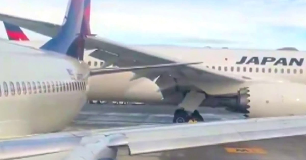 Plane's Wing Slices Into Tail of Another Jet at Seattle Airport
