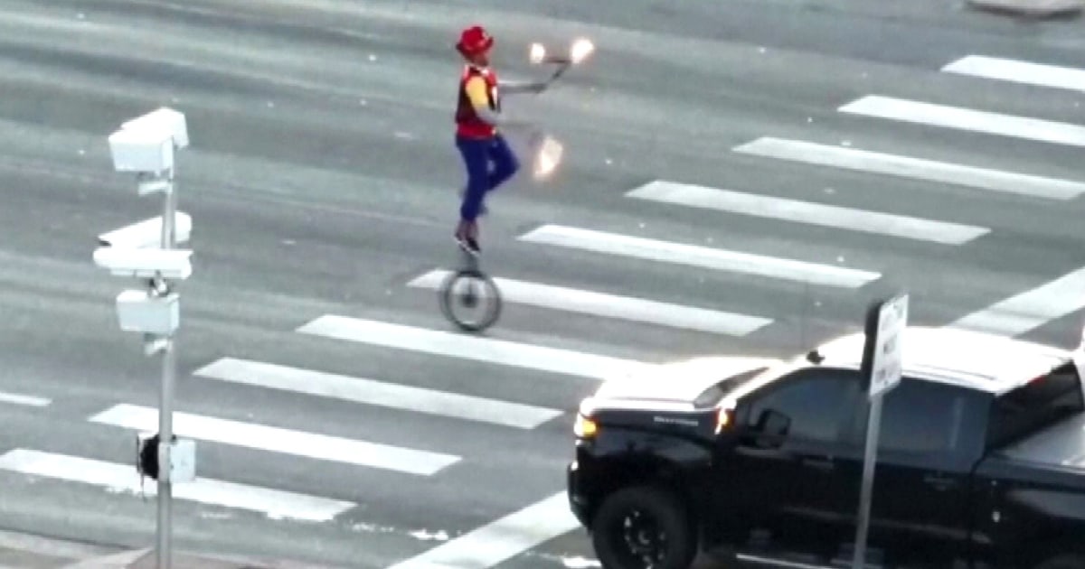 Fire-Juggling Unicyclist Performs Show at Colorado Intersection
