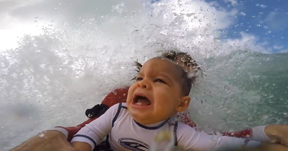 Watch as a father takes his 9-month-old son bodyboarding
