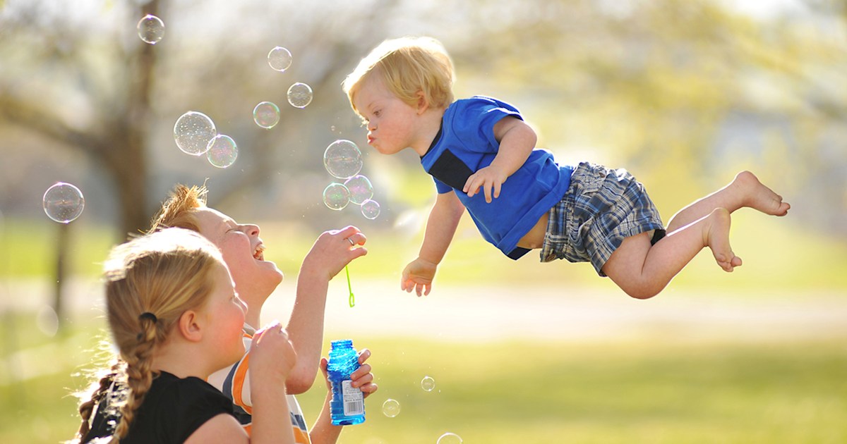 Dad's beautiful 'flying' photos of son with Down syndrome go viral