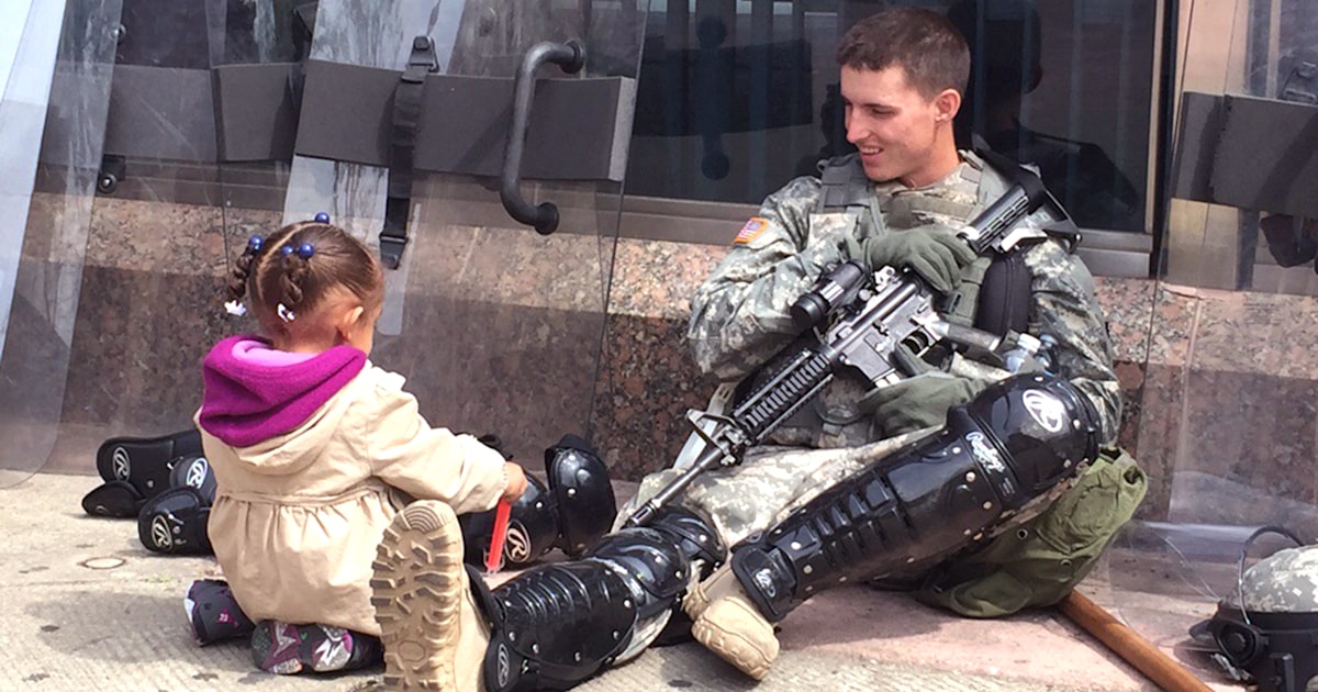 Viral photo of Baltimore girl with armed Guardsman is 'tragic ...