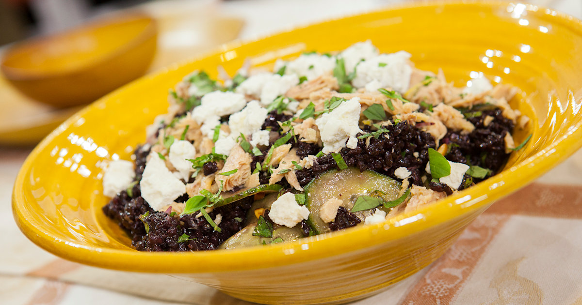 Forbidden black rice salad with cucumbers, herbs and canned tuna