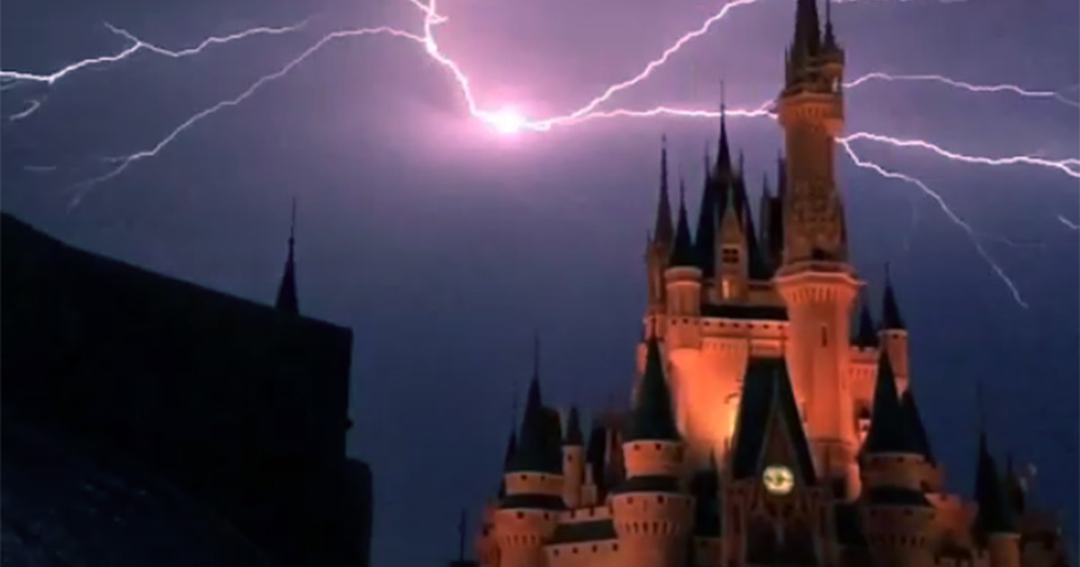 Cinderella’s Castle at Disney World lit up by lightning