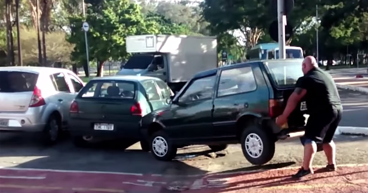 The world’s strong cyclist? Man lifts car blocking bike lane