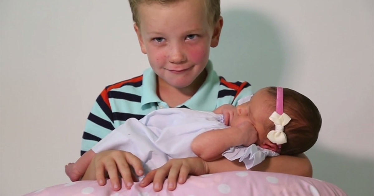 Six brothers welcome home baby sister, melt hearts