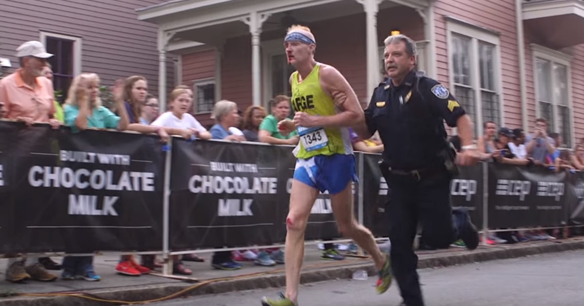 Georgia policeman helps injured runner cross finish line in honor of ...