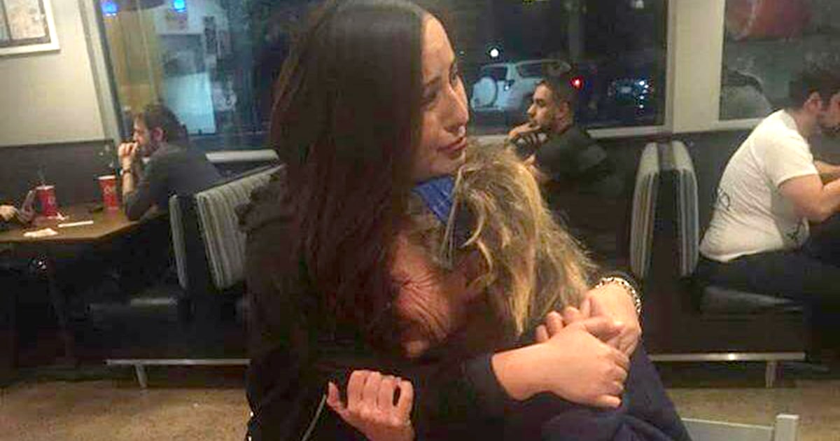 Homeless woman offers emotional hug to stranger who bought her a warm meal