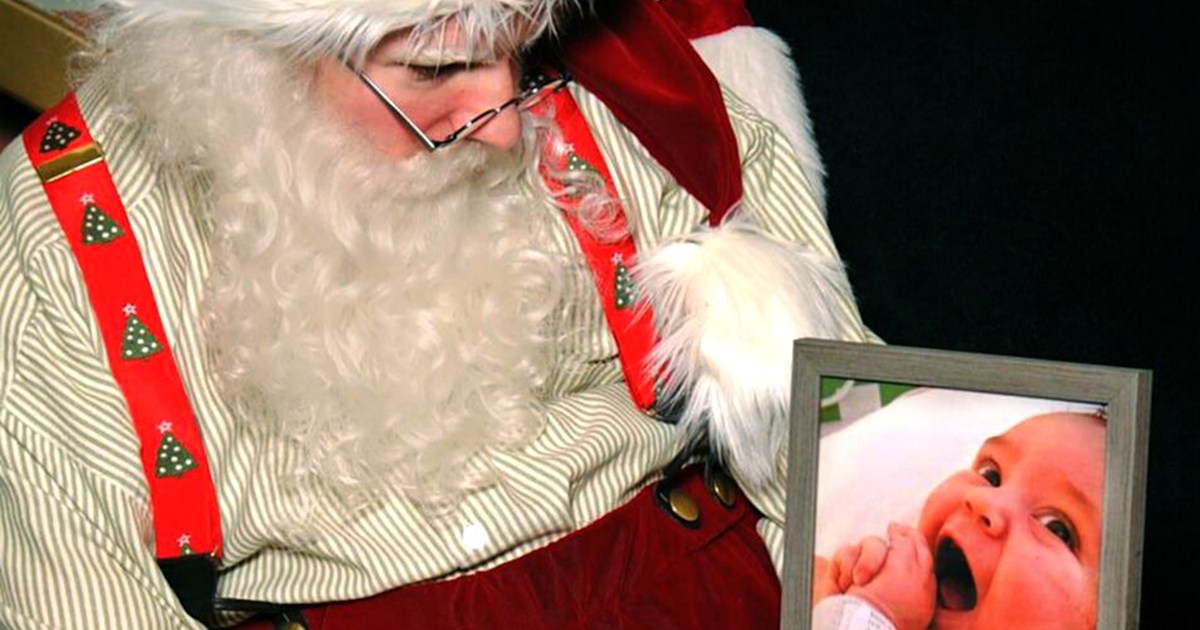 Santa holds baby son's photo to grant grieving dad's wish