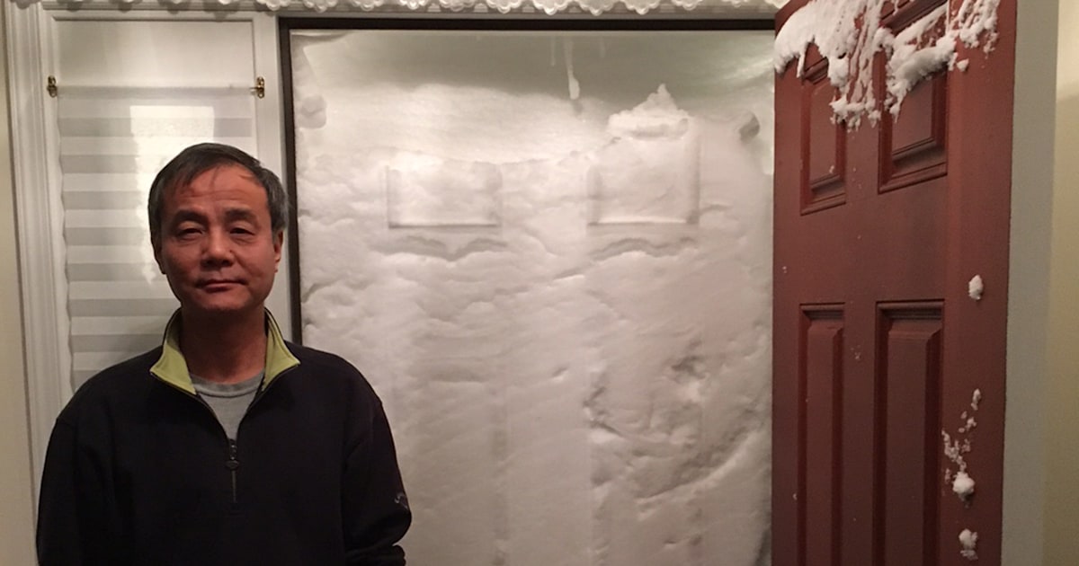 New Jersey couple's front door is covered entirely with snow after blizzard