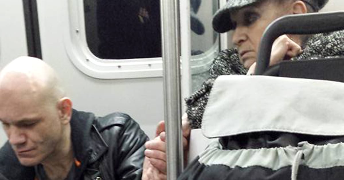 Powerful photo captures woman’s touching gesture to aggressive man on train