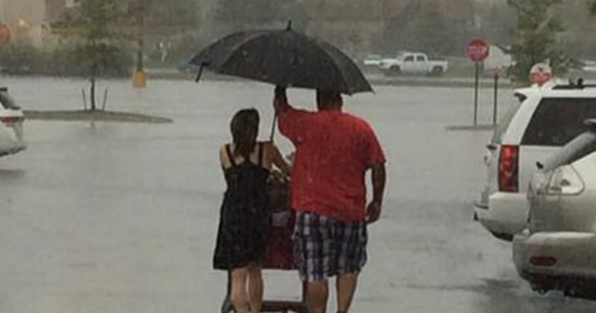 Photo of man holding umbrella for strangers at Louisiana Target goes viral