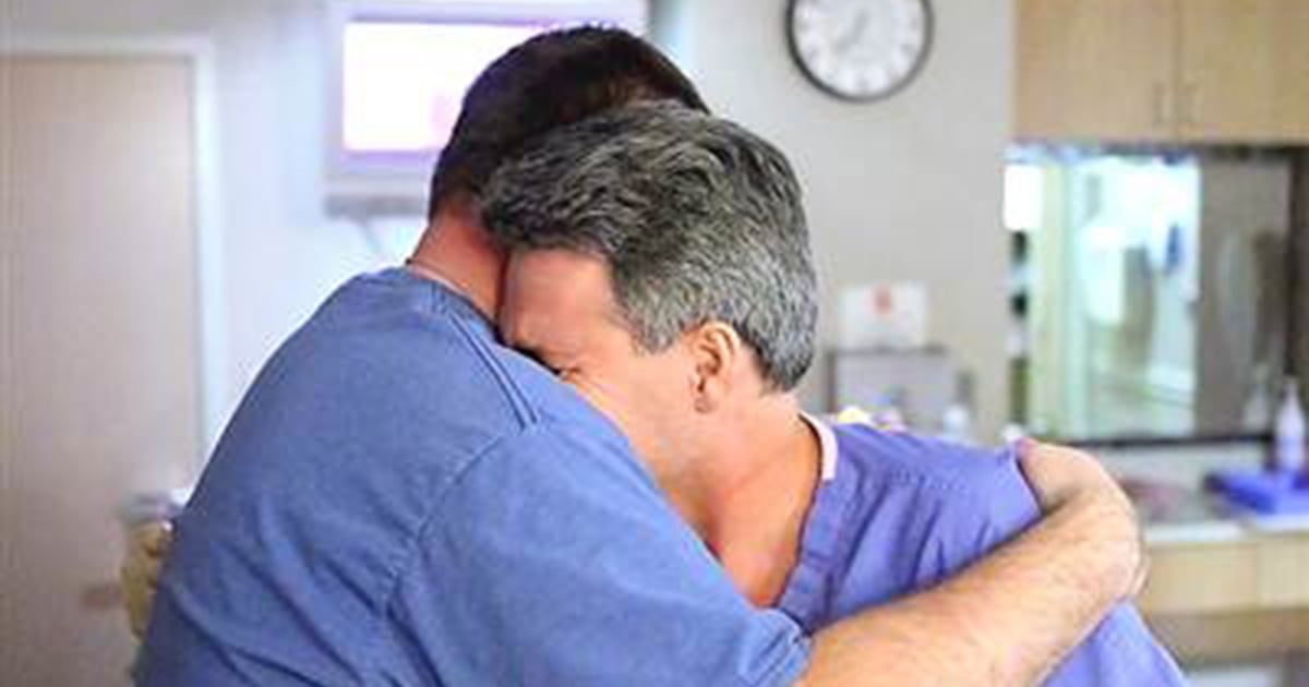 Dad-doctor hug photo goes viral after birth of 'rainbow baby'
