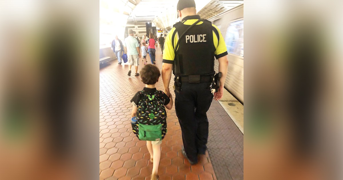 Police officer comforts little boy with autism on train
