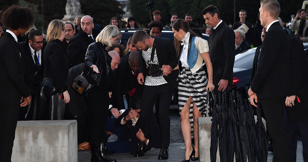 Justin Timberlake grabbed on red carpet at Paris Fashion Week