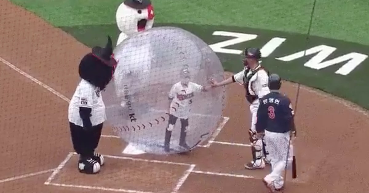 Boy in bubble 'throws out' 1st pitch at Korean baseball game