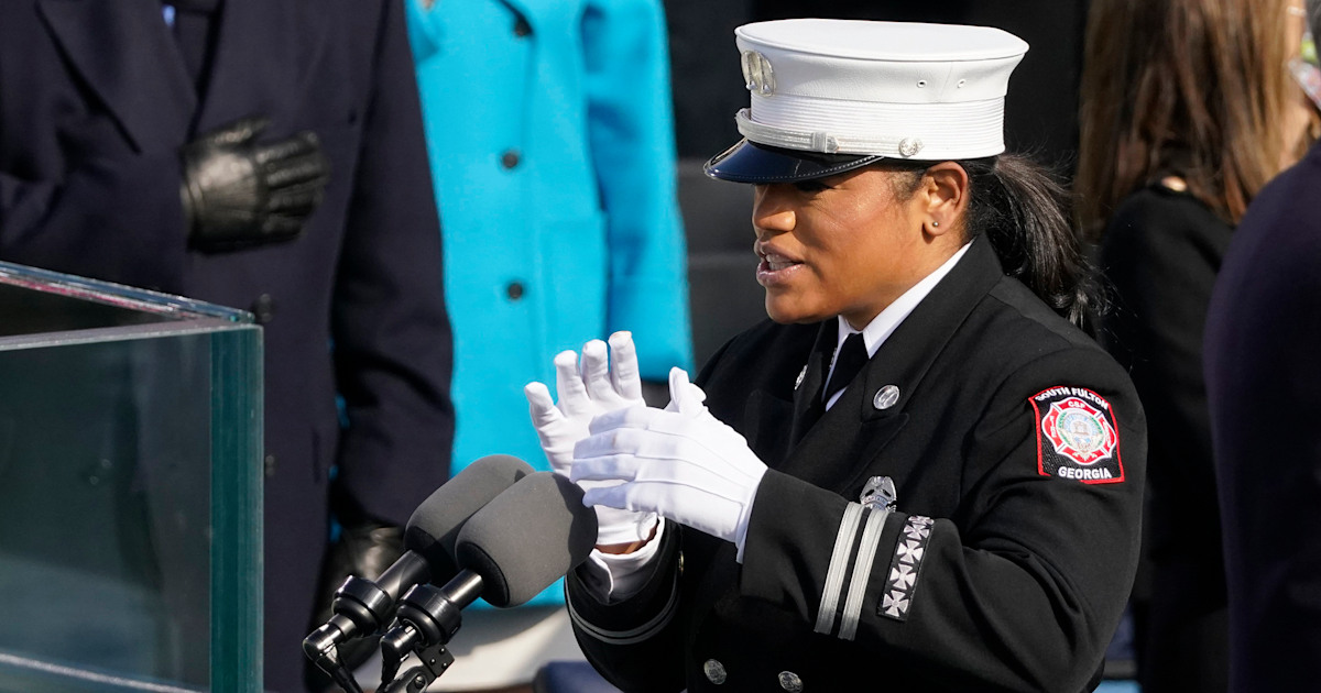 Firefighter Andrea Hall signs Pledge of Allegiance at inauguration