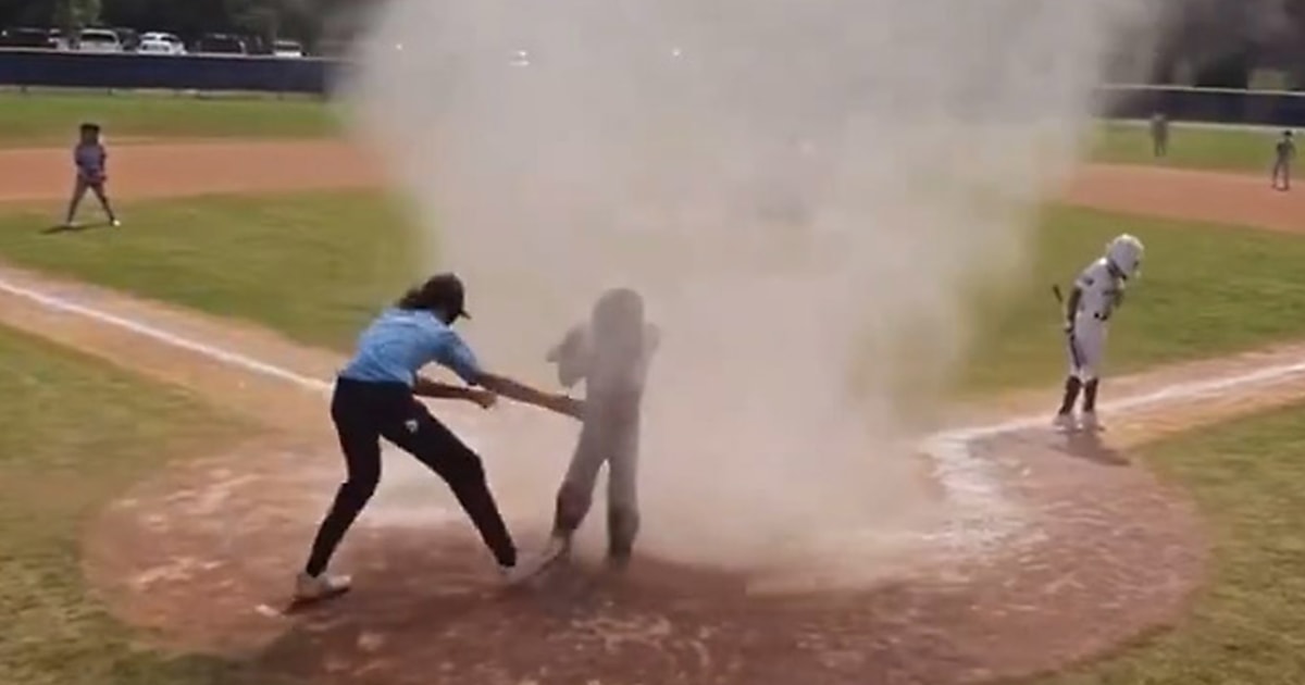 Teen Umpire Helps Youth Baseball Player Caught In Dust Devil