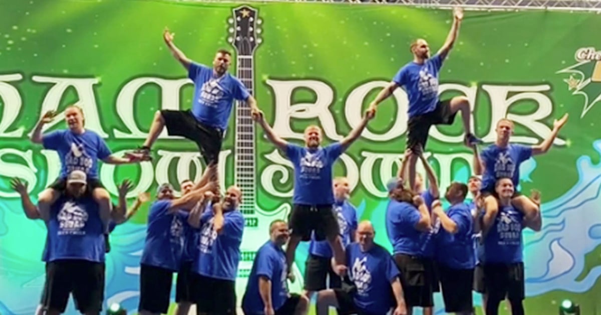 Watch These 'Cheer Dads' Perform Stunts In Viral Video