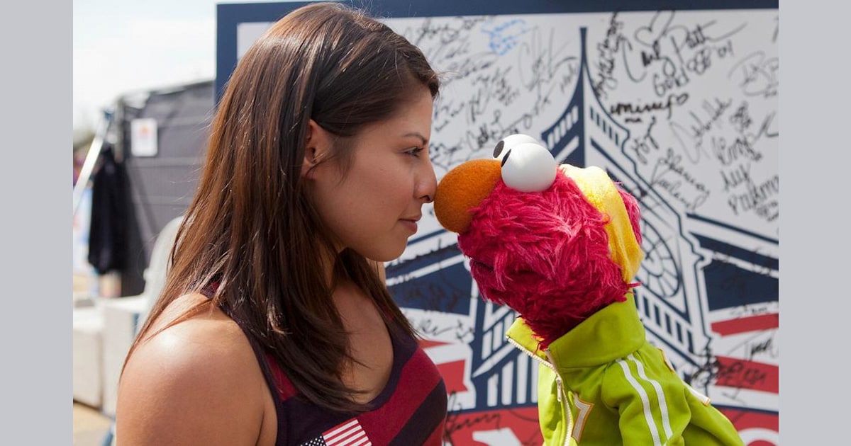 Caption contest: Elmo, Olympic boxer face off