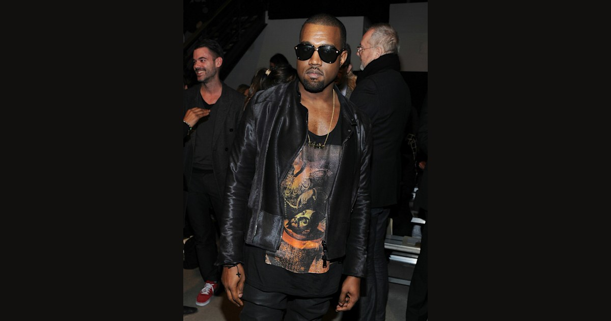 Kanye's handler's keeping him in line at Fashion Week