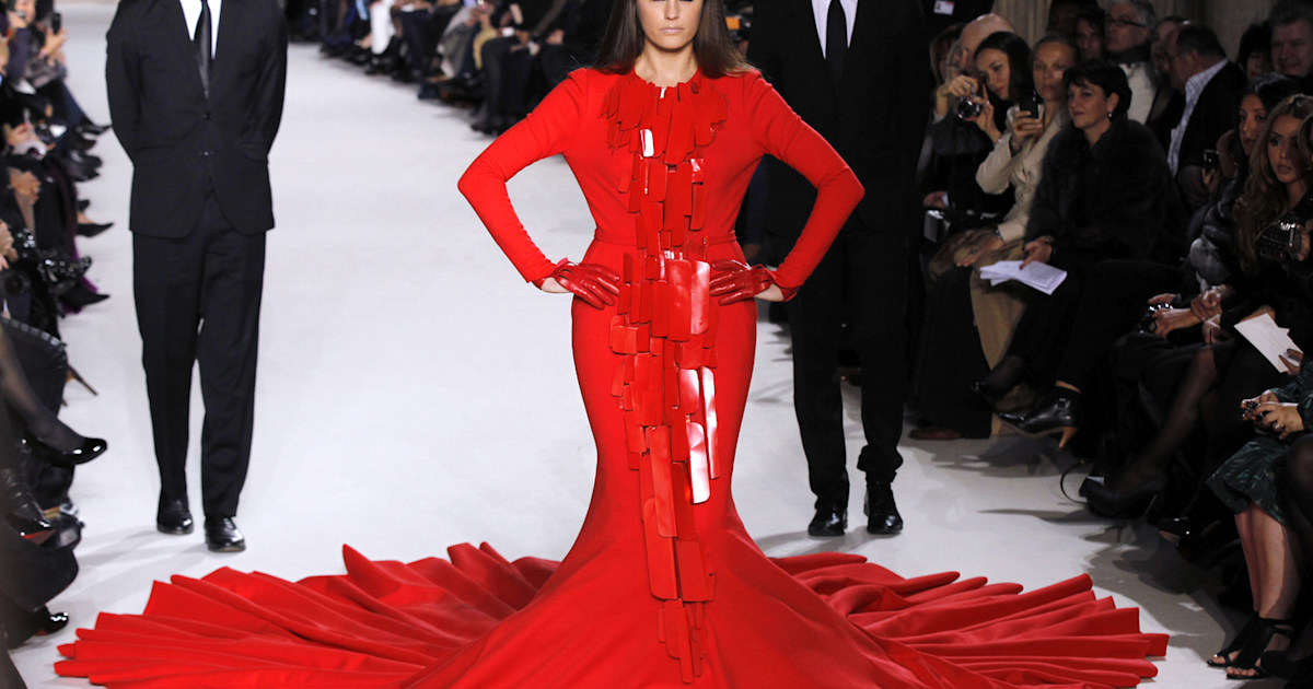 Former supermodel walks runway in 110-pound couture gown