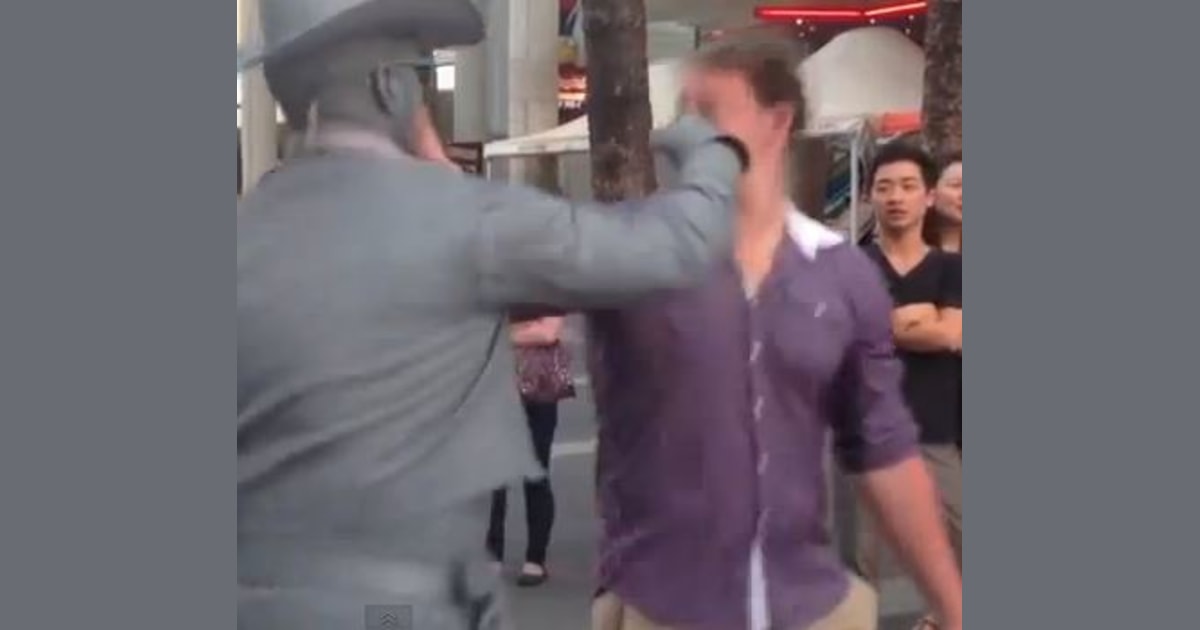 Human statue punches heckler over 'Wet Willie'