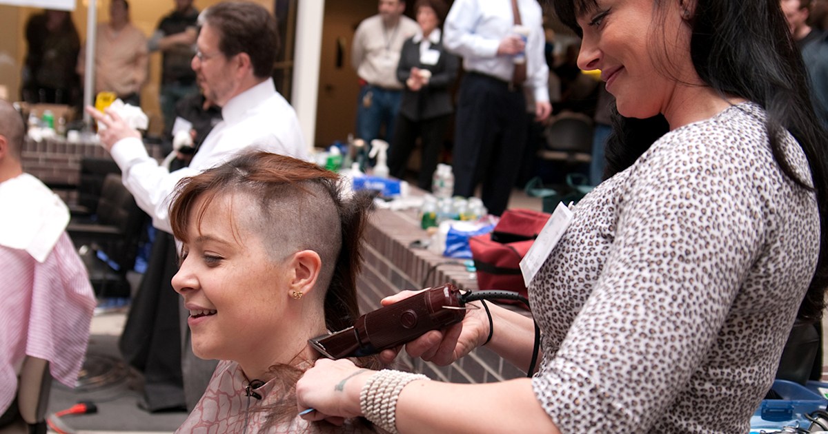 A hairy challenge: 428 employees shave heads for cancer charity
