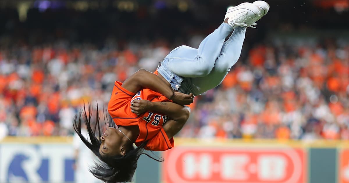 Simone Biles puts her own twist (and a backflip) on first pitch at ...